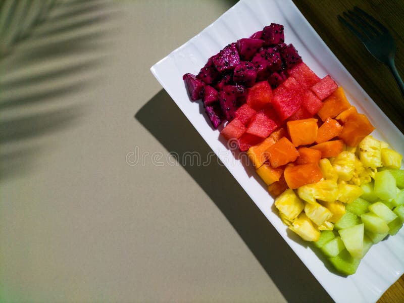 Rectangular Plate with Fruits Salad on Brown Background Stock Image ...