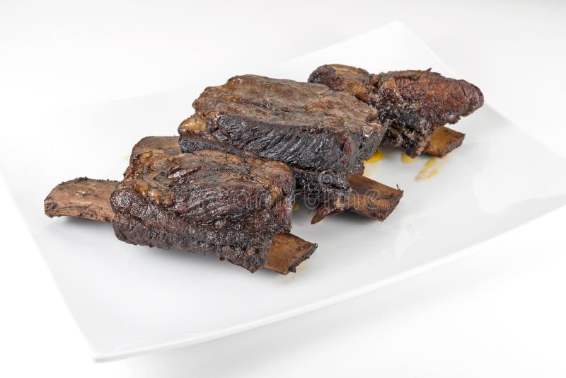 White Rectangular Plate with Three Cooked Beef Ribs Stock Photo - Image ...