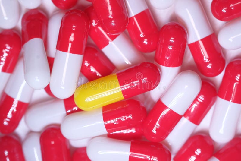 White and Red Color Capsule Spilling Stock Image - Image of white ...