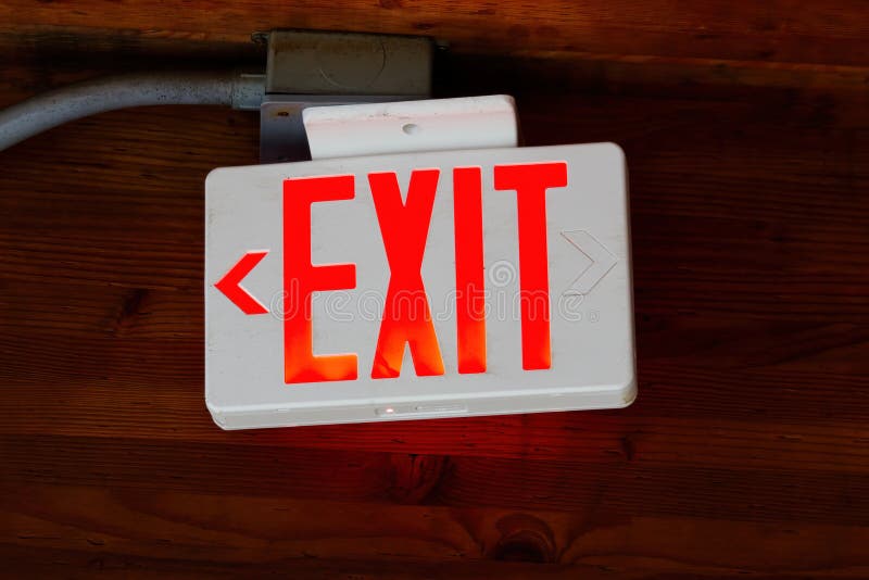 Illuminated Exit Sign with Electrical Box and Wood Beams Stock Photo ...