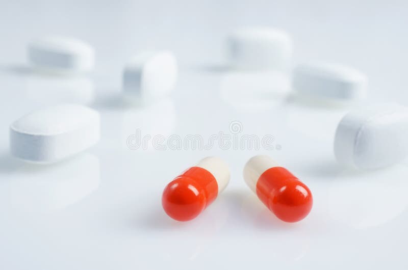 White and Red Medicine Antibiotic Pills Stock Photo - Image of medical ...