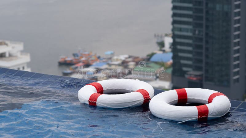 White Red Pool Ring or Swim Ring in the Swimming Pool on the Rooftop of ...