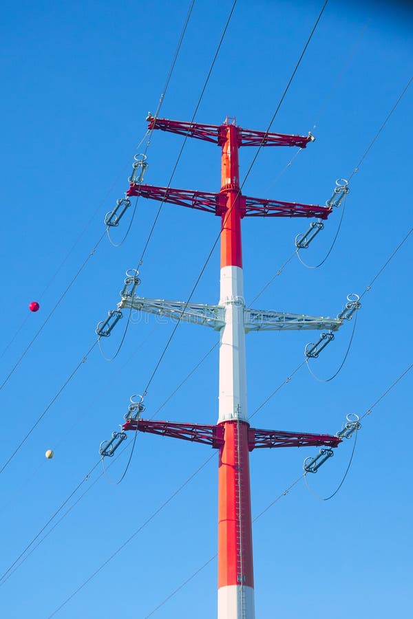 Electrical Post with Power Line Cables, Transformers Against Bright ...
