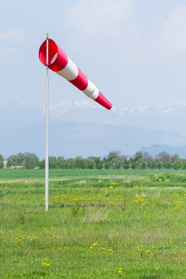 Windsock on grass runway stock photo. Image of runway - 5426536