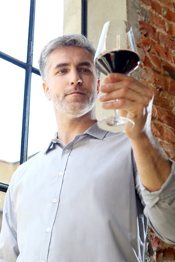 White or Red Wine? Man Pours Wine into a Glass. Stock Photo - Image of ...
