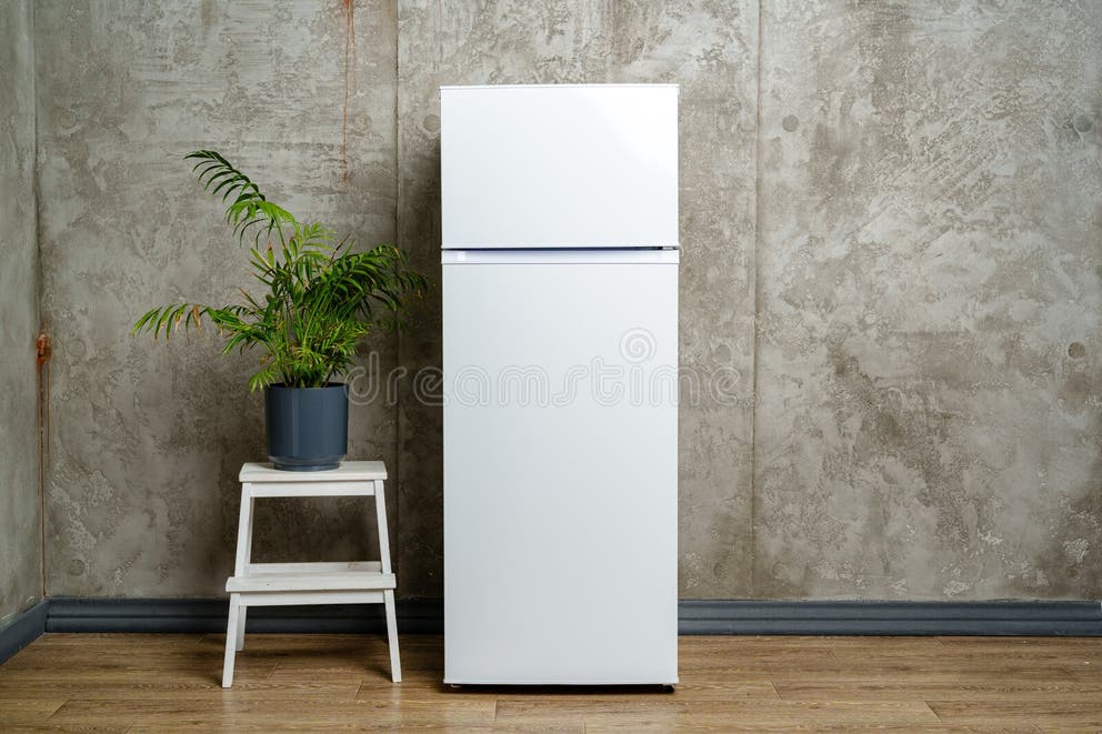 White Refrigerator Against Concrete Wall Stock Photo - Image of kitchen ...
