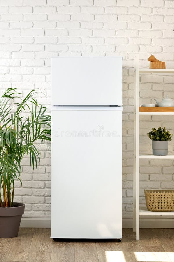 White Refrigerator in a Modern Kitchen with Brick Wall Stock Photo ...