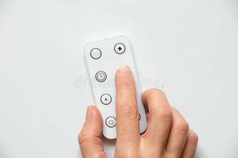 White Remote Control on a White Background Close Up .Hand on the Remote ...