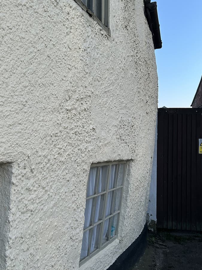 White Rendered Building with Large Bend in Wall, Bowing Wall Stock ...