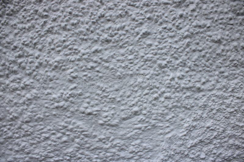 White Rendered Wall with Large Bumpy Rendering Finish Stock Photo ...