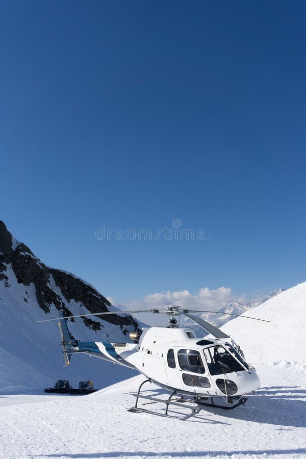 White Rescue Helicopter Parked in the Mountains Stock Image - Image of ...