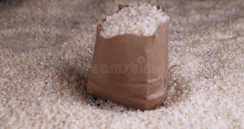 White Rice in the Bag Falls and Crumbles on the Table Stock Video ...