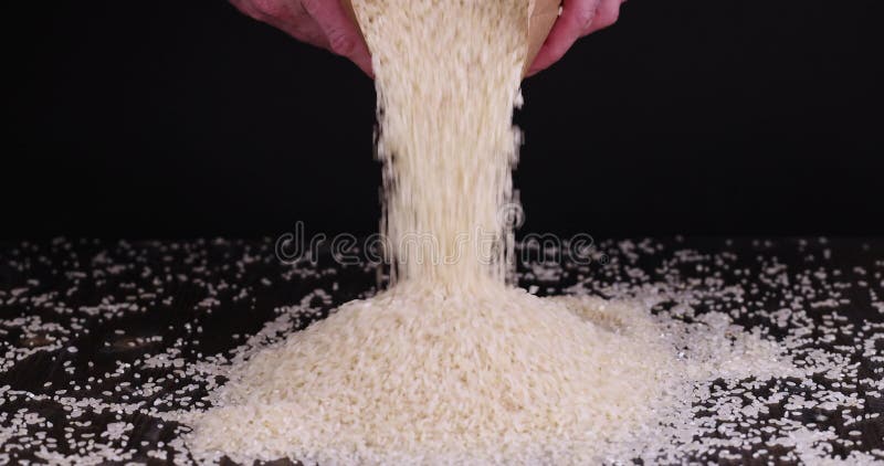 White Rice in a Bag is Poured Out on the Table Stock Footage - Video of ...