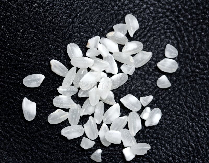 White Rice on a Black Background. Macro Stock Photo - Image of grain ...