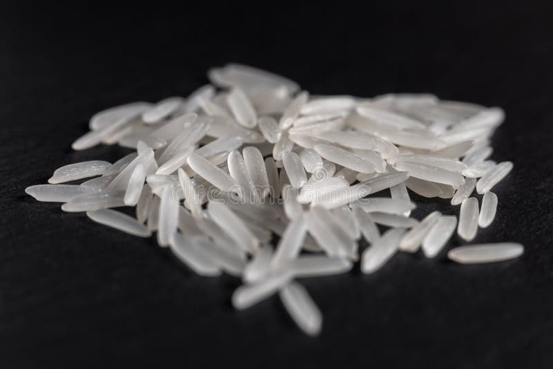 White Rice on a Black Graphite Stone Slab Stock Photo - Image of ...