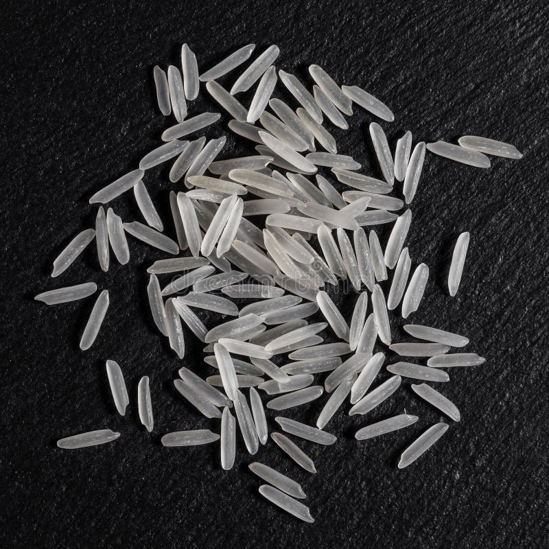 White Rice on a Black Graphite Stone Slab Stock Photo - Image of ...