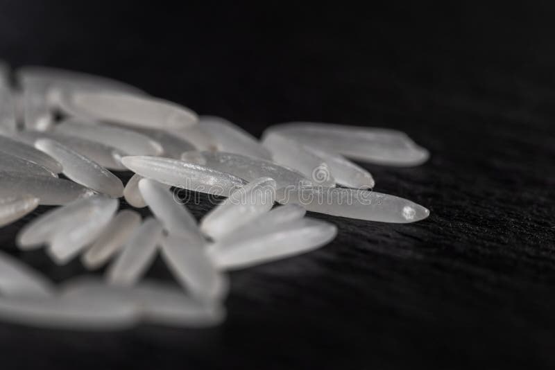 White Rice on a Black Graphite Stone Slab Stock Image - Image of ...