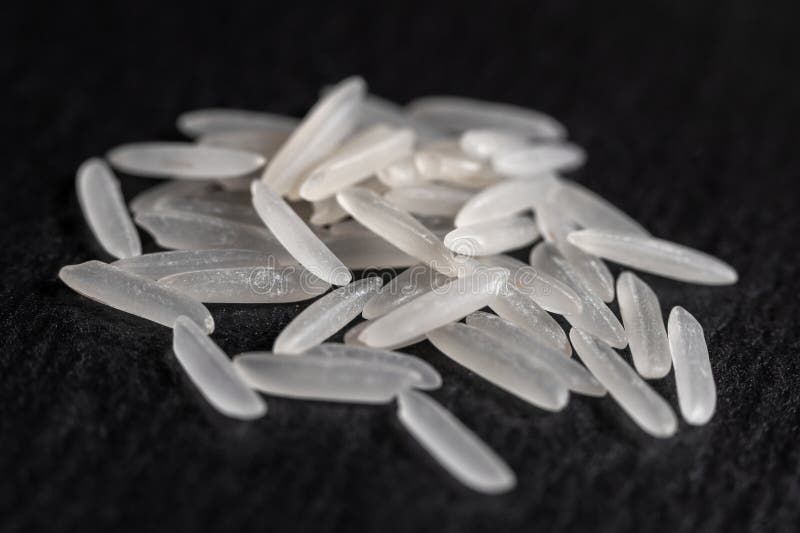 White Rice on a Black Graphite Stone Slab Stock Photo - Image of ...