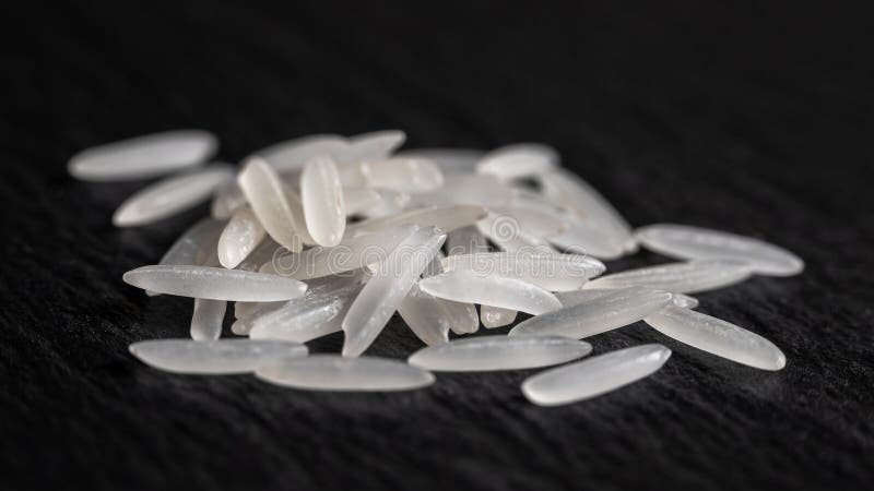 White Rice on a Black Graphite Stone Slab Stock Photo - Image of white ...