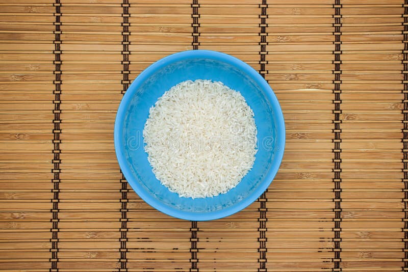 White rice in blue dish stock photo. Image of natural - 143890458