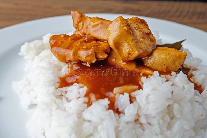 White Rice and Chicken Pieces in Bbq Red Sous. Asian Style Dish Stock ...