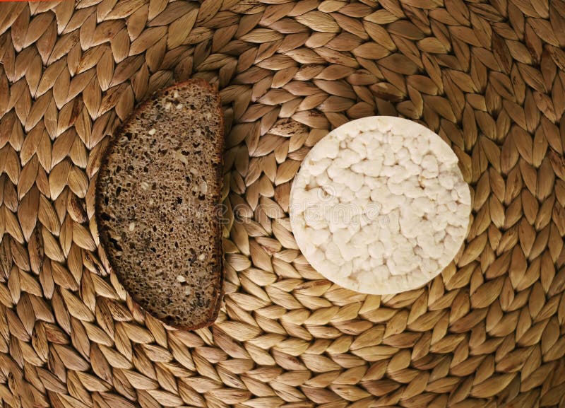 White Rice Crackers and Bread on Whicker Place Mat. Stock Photo - Image ...