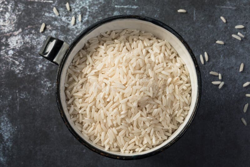 Uncooked White Rice in a Metal Cup Stock Image - Image of isolated ...