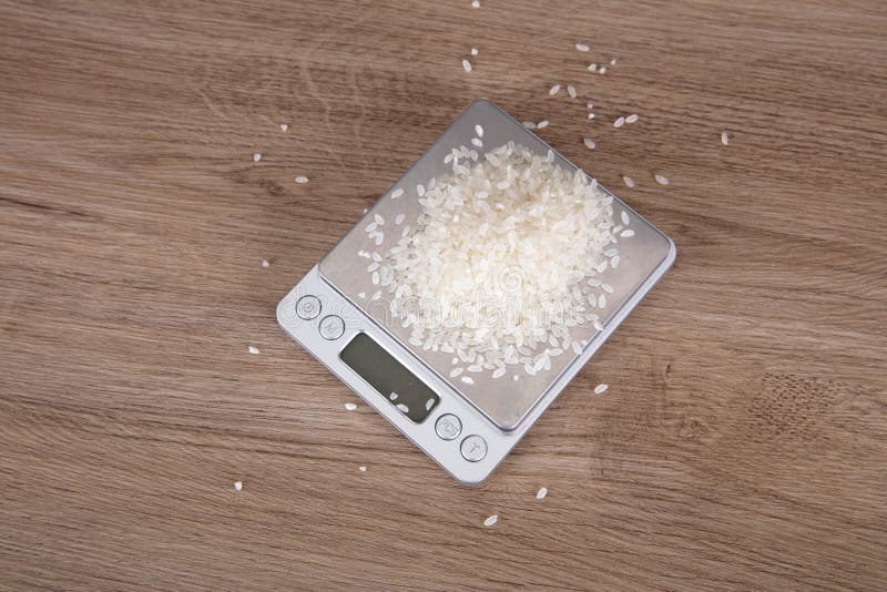White Rice on Electronic Scale Stock Photo - Image of electronic ...