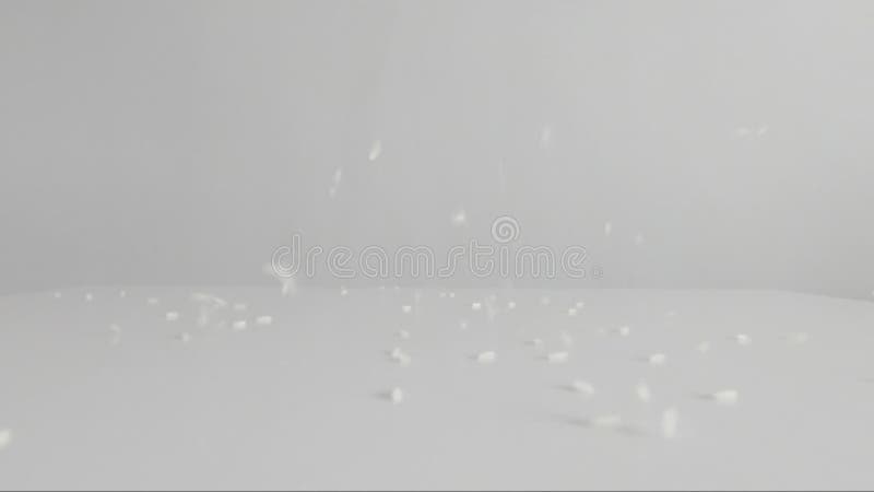 Slow Motion of White Rice Falling on a Table Stock Video - Video of ...