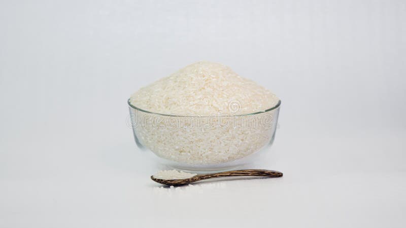 White Rice Grains in a Clear Container, White Background, Isolated ...