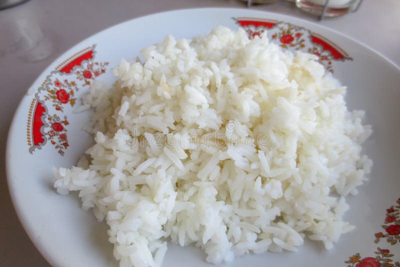 White rice on plate stock photo. Image of isolated, cereal - 135356308