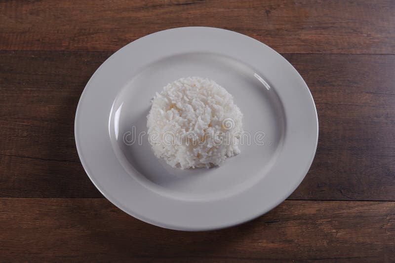 White Rice in Plate on Wooden Table Stock Photo - Image of white ...