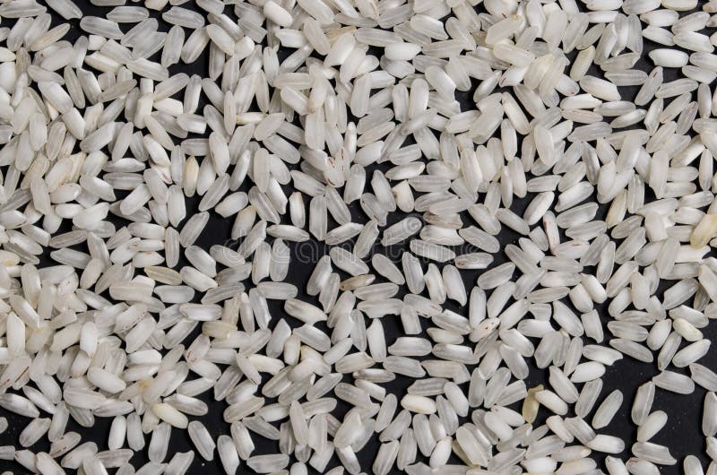 White Rice Scattered on an Isolated Black Background. Stock Photo ...