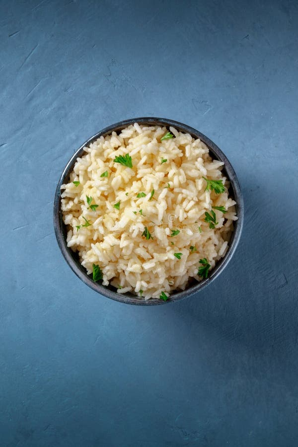 White Rice, Shot from the Top on a Dark Blue Background Stock Photo ...