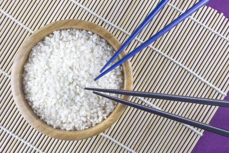 White rice with sticks stock image. Image of violet, meal - 48862933