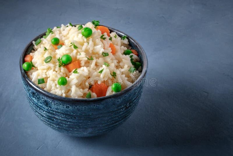 White Rice with Veggies on a Blue Background with Copy Space Stock ...