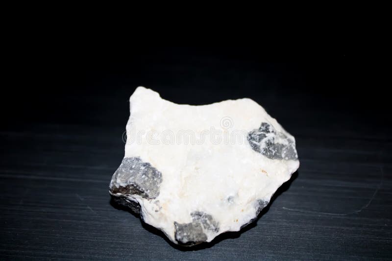 White Rock with a Black Background. Stock Photo - Image of bumpy, clay ...