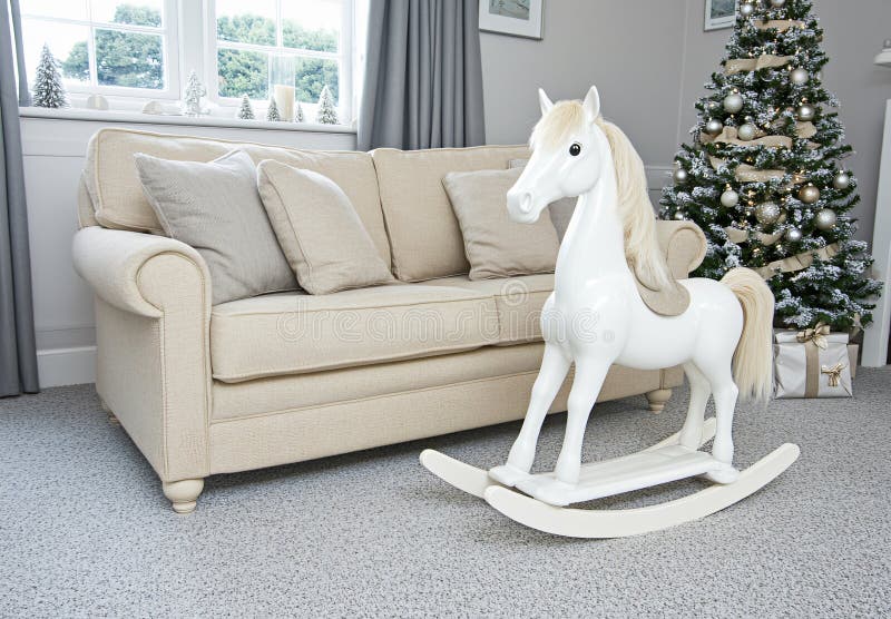 White Rocking Horse on Beige Sofa Christmas Setting High Quality Image ...