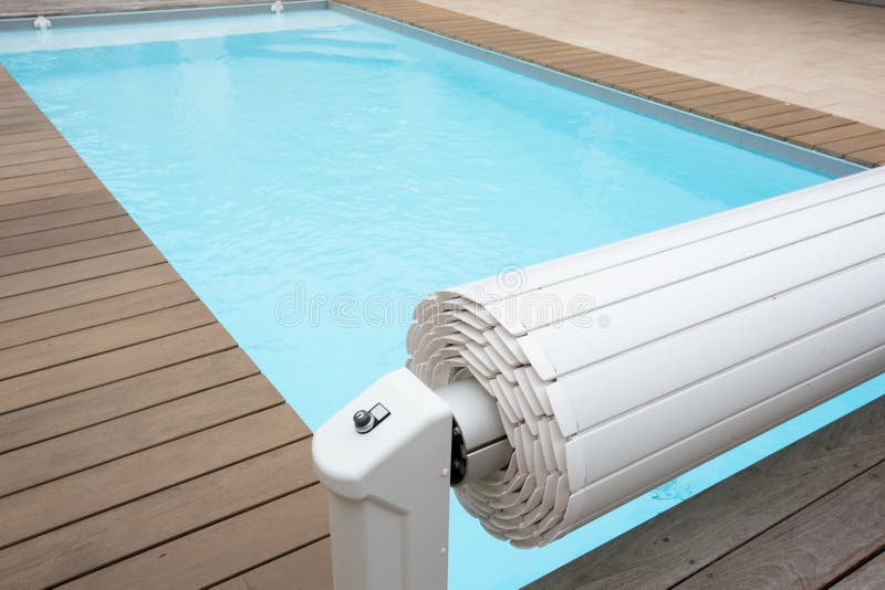 White Rolling Shutterpool Protection on Blue Swimming Pool Cover Stock ...