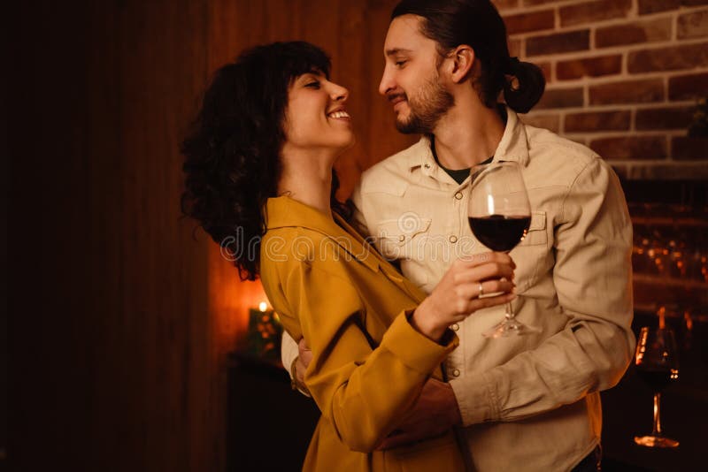 White Romantic Couple Dancing while Drinking Wine at Home Stock Image ...