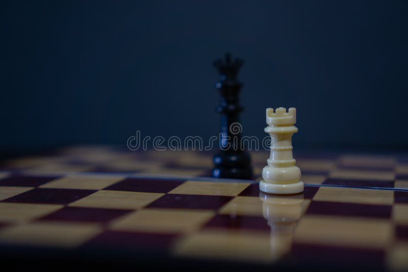 White Rook and Black King Chess Pieces Stock Photo - Image of pawns ...