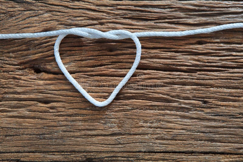 White Rope Heart Shape on Wood Texture with Copy Space Use for a Stock ...