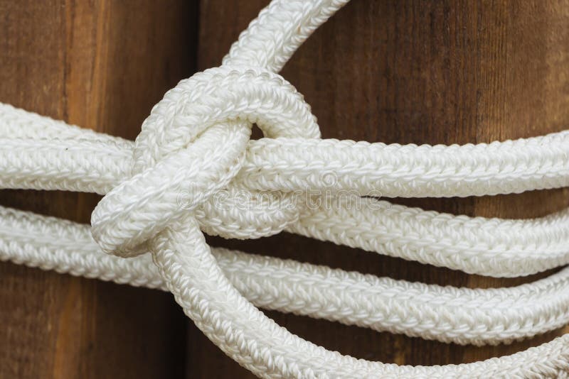 White Rope with a Knot on Wooden Background. Stock Photo - Image of ...