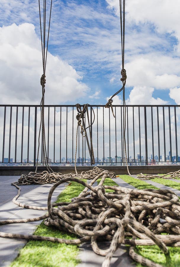 White Rope Tied on Iron Bar on Building Roof. Stock Photo - Image of ...
