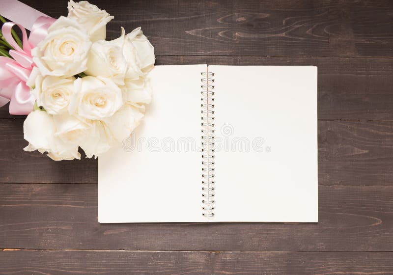 White Roses Flower with Ribbon are on the Notebook Stock Image - Image ...