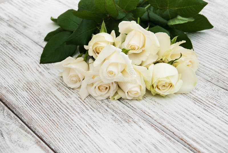 White Roses on a Wooden Table Stock Photo - Image of flowers, roses ...