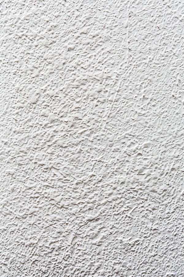 White Rough Concrete Wall Providing a Textured Background with Signs of ...