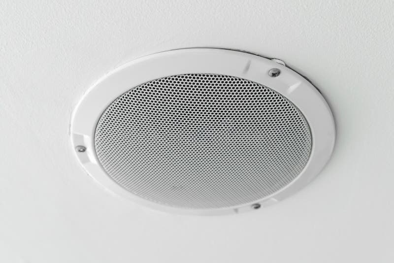 White Round Circle Speaker and Grille Hanging on Ceiling Stock Photo ...