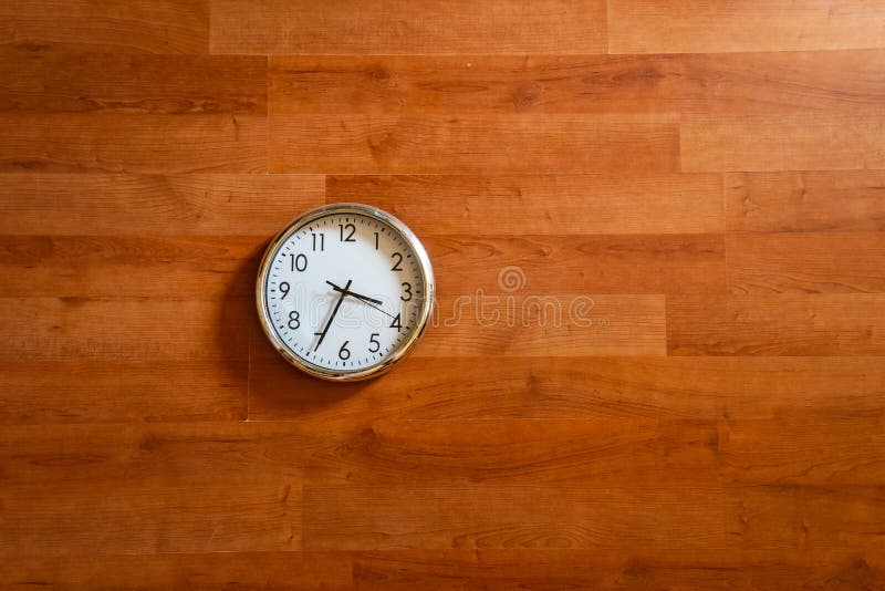 White Round Clock on Wooden Floor.Round Classic Clock Lying on a Wooden ...