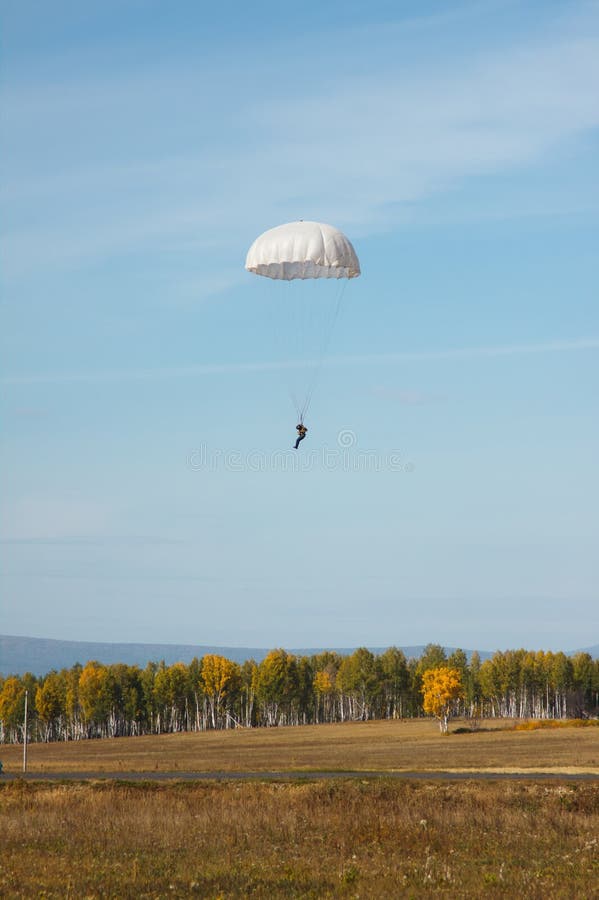 White Round Parachute on the Background of the Autumn Landscape. Stock ...